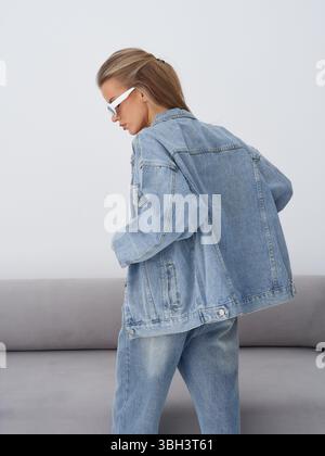Beautiful blonde woman showcases her fashion sense in denim, styled ...