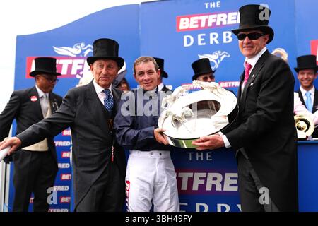 Jockey Wayne Lordan (centre) and trainer Aidan O'Brien (centre right ...