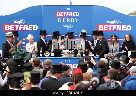 Jockey Wayne Lordan (centre) and trainer Aidan O'Brien (centre right ...