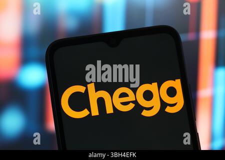 In this photo illustration, the Chegg logo is displayed on a smartphone ...