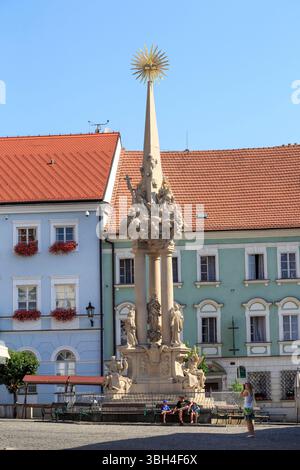 Statue of the Holy Trinity, Sousoší Nejsvětější trojice, with the clock ...