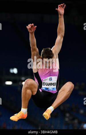 Simon Ehammer, of Switzerland, competes in the long jump event in front ...