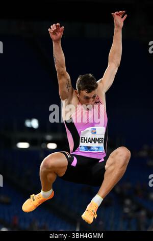 Simon Ehammer, of Switzerland, competes in the long jump event in front ...