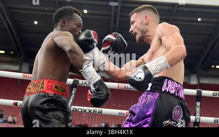 Rhys Edwards (right) in action against Thomas Essomba (left) at Oakwell ...
