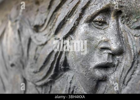 Bas-relief face of a suffering woman. Backgrounds and concepts Stock ...