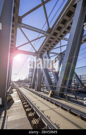 Modern railway steel bridge over highway Stock Photo - Alamy