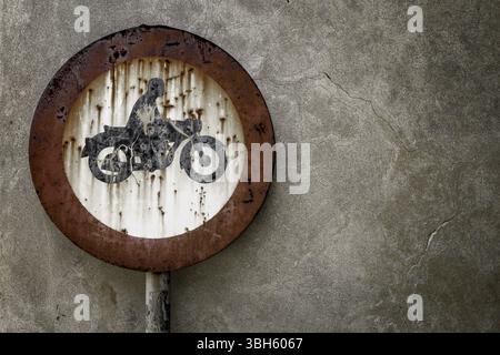 Road sign ban for motorcycles, rusted from the elements Stock Photo - Alamy