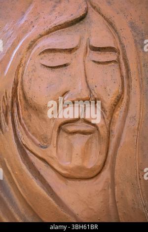 A relief sculpture of Jesus' face. Made out of modelling clay by Lubo ...