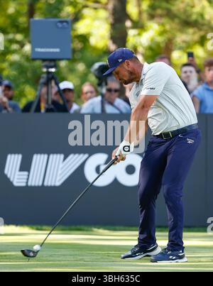 Bryson DeChambeau tees off on the 12th hole during the first round of ...