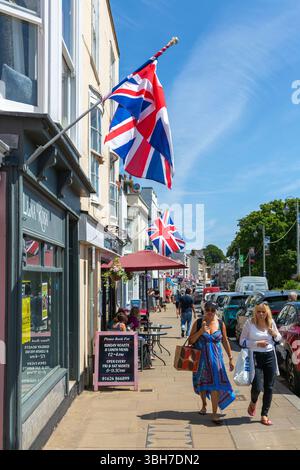 Union Jack flags on shops in street of historic buildings, The Strand ...