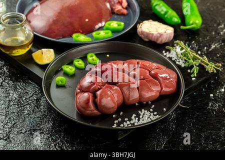 Fresh raw beef kidney on white background Stock Photo - Alamy