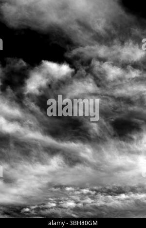 High contrast Dramatic dark sky and clouds copy space in black and ...