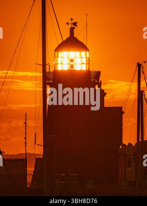 Sunset aligned with Howth Lighthouse Stock Photo - Alamy