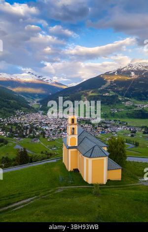 View of a spring sunset over Bormio city from the church of Madonna di ...