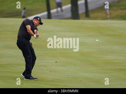 Phil Mickelson hits from the 8th tee during the third round of the ...