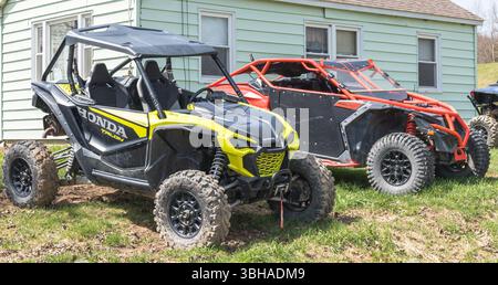 Different off road UTVs, utility task vehicles, lined up for sale at a ...