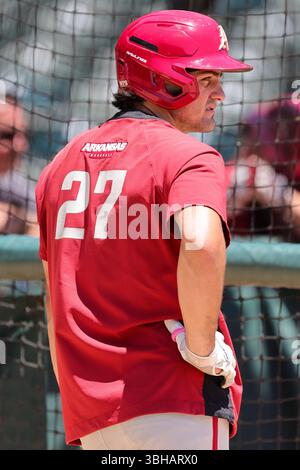 June 1, 2025: Arkansas catcher Ryder Helfrick (27) lifts his mask to ...