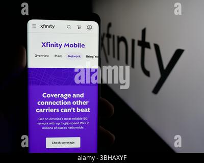 In this photo illustration a Comcast Cable Communications, LLC, doing ...