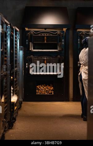 Artisan baker and pastry chef. Detail of apple turnover pastries in a ...