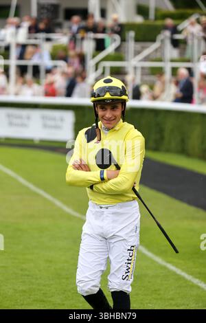 Horse racing jockey in the parade ring Stock Photo - Alamy