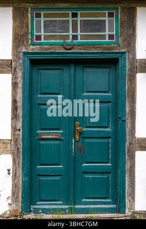 Brass mail slot on a wooden gate Stock Photo - Alamy