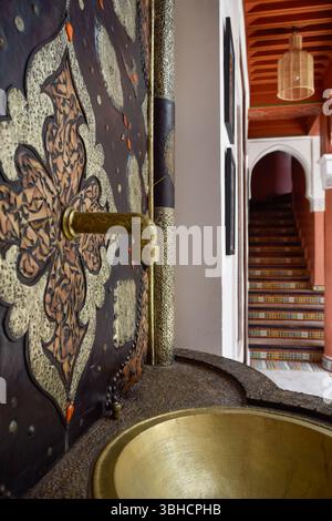 Faucet and fountain with Arabic stairs in background. Typical Marrakech ...