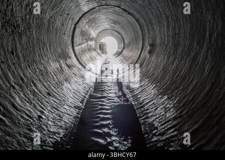 Exit from the drainage sewage tunnel pipe. Concrete Drainage Pipe, collector of city sewage ...