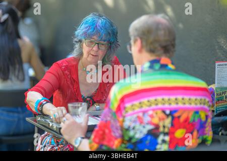Couple playing backgammon at sidewalk restaurant bar patio Stock Photo ...