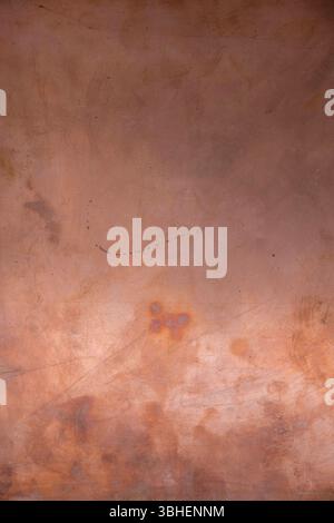 Copper surface with light reflection. There are scratches on the copper ...