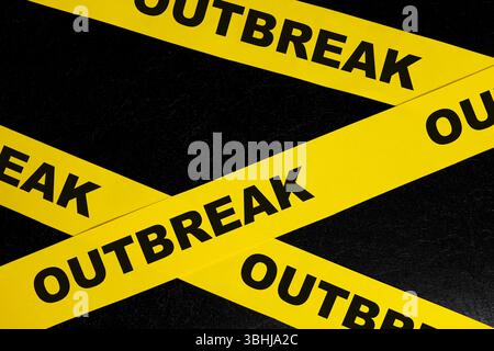 Disease outbreak warning concept. Yellow barricade tape with word in ...