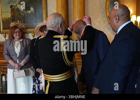 Rugby league star Billy Boston being Knighted by King Charles III at ...