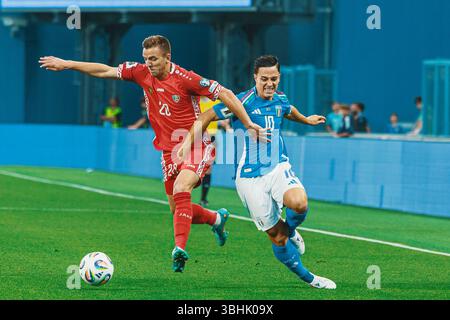 Italian player Giacomo Raspadori in a duel with Moldovan Victor Mudrac ...