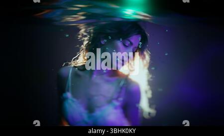 Fantasy water photography: beautiful woman's face seen through ripples ...