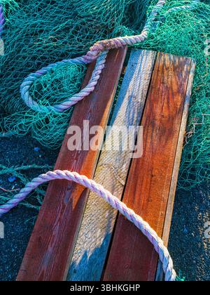 View of fishing nets on the ground. Big green fishing net. Close-up ...