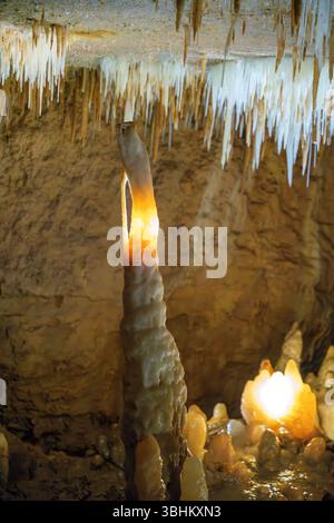 Ancient limestone columns and stalactites forming impressive geological ...