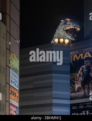 A giant Godzilla head in the Shinjuku district towers 52 meters (170 ft ...