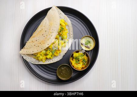 Crispy Masala dosa is a popular South Indian food item served with ...