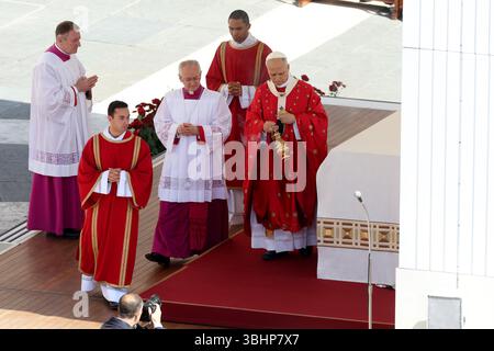 Pope Leo XIV blesses a new born as he arrives for his weekly general ...