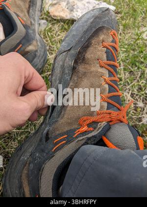 Old worn hiking boots with detached soles after challenging mountain ...
