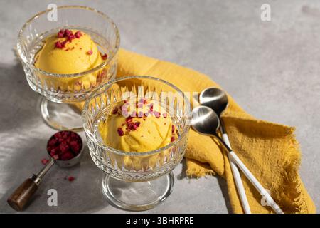 Mango and passion fruit ice cream ball Stock Photo - Alamy