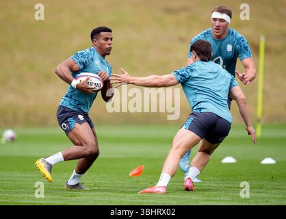 England Immanuel Feyi-Waboso, left, is challenged by New Zealand Josh ...