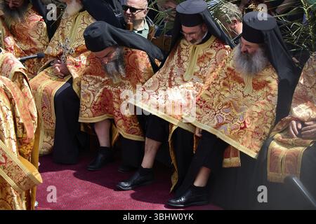 Orthodox priests in elaborate robes gather during a solemn religious ...