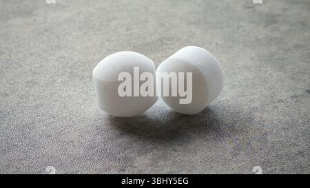 White naphthalene balls on gray background Stock Photo - Alamy