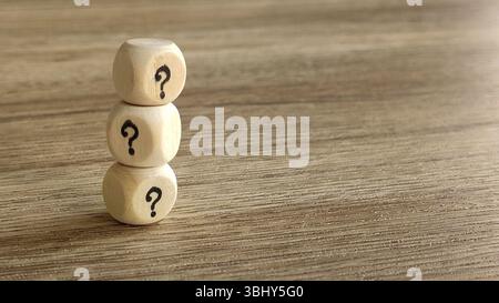 Three Wooden Dice with Question Marks Stock Photo - Alamy