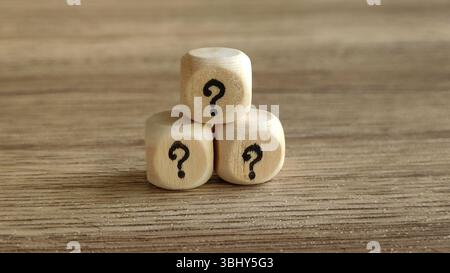 Three Wooden Dice with Question Marks Stock Photo - Alamy