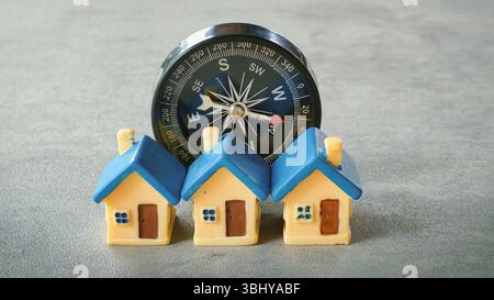 miniature house on a compass Stock Photo - Alamy