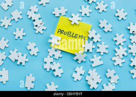 Scattered Puzzle Pieces with Yellow Sticky Note Reading "Problems" on ...