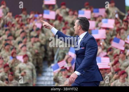Defense Secretary Pete Hegseth greets fans before a NASCAR Cup Series ...