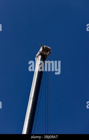 Hydraulic crane boom extended at Radcliffe hub construction site town ...