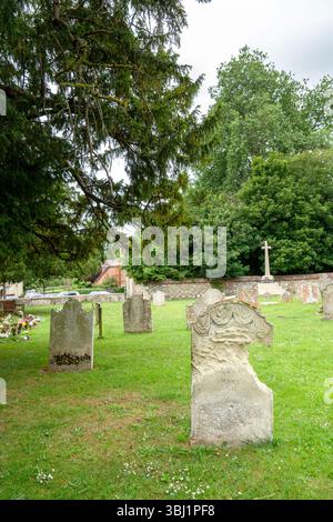 Badly eroded grave stone Stock Photo - Alamy